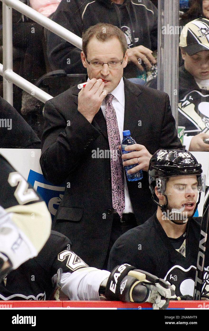 Pittsburgh Penguins head coach Dan Bylsma watches from the bench as his ...