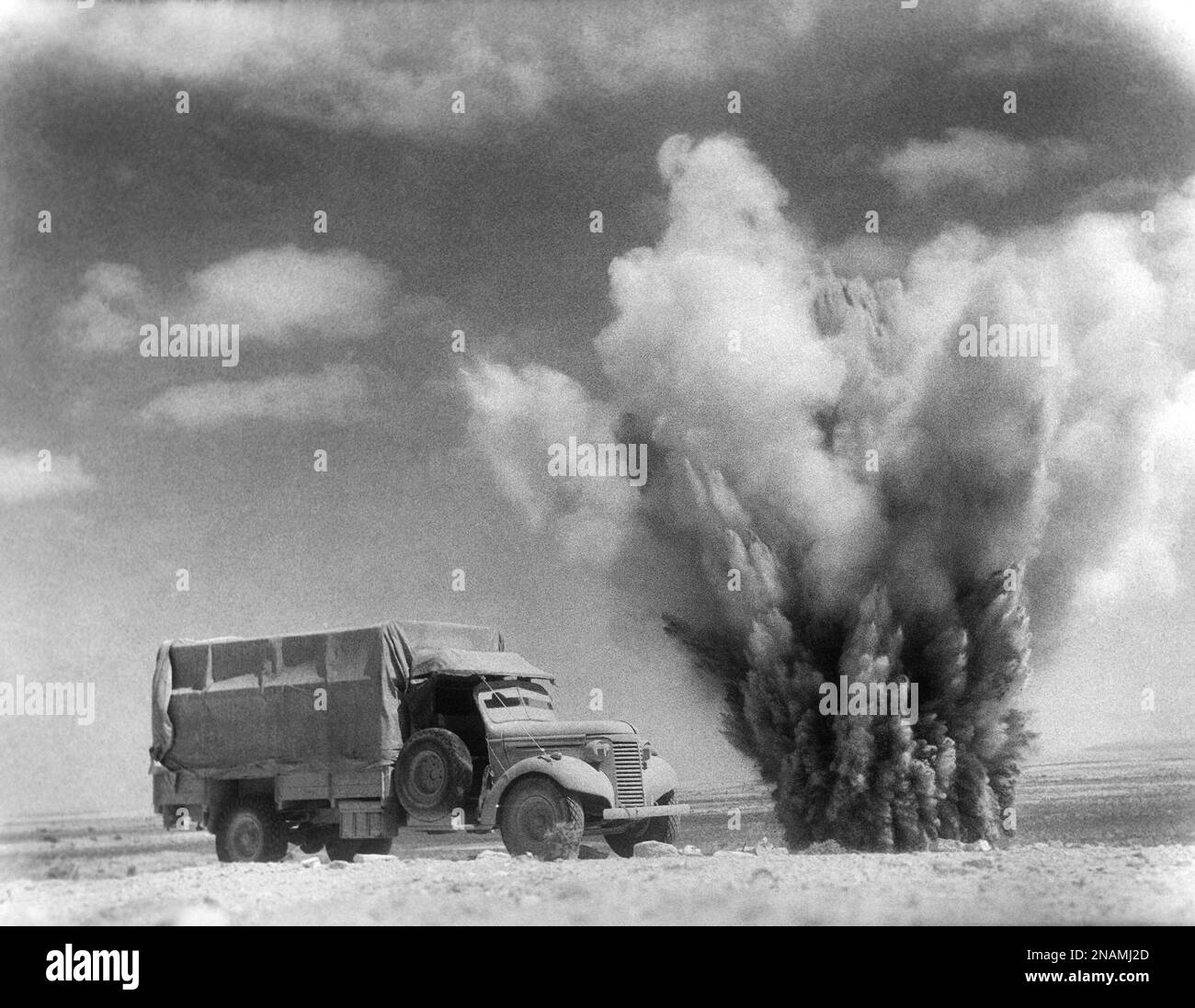 A United Nations vehicle has a close call as a near hit explodes ...