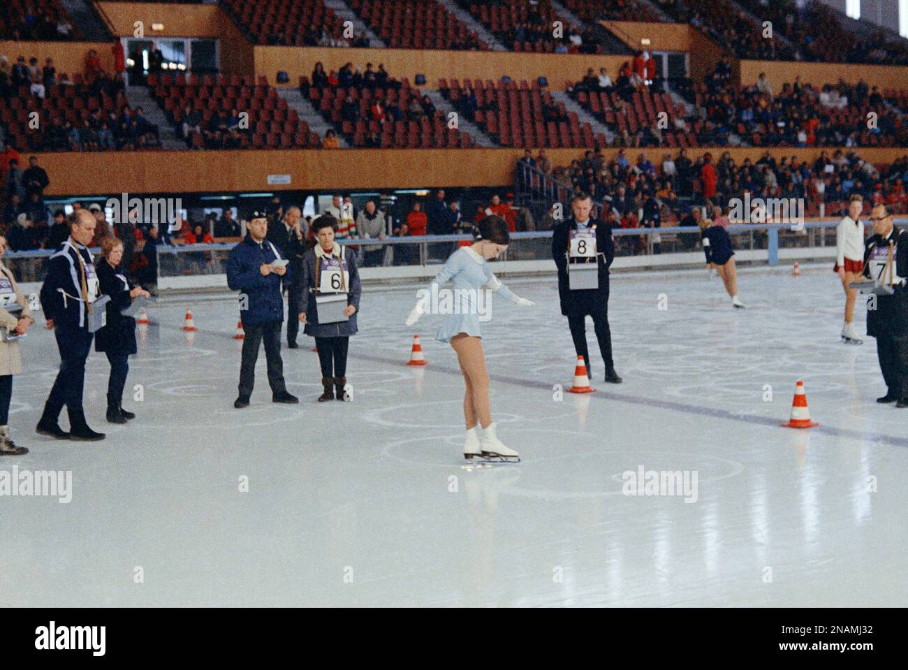 Peggy Fleming, U.S. figure skating entrant, performing in compulsory ...