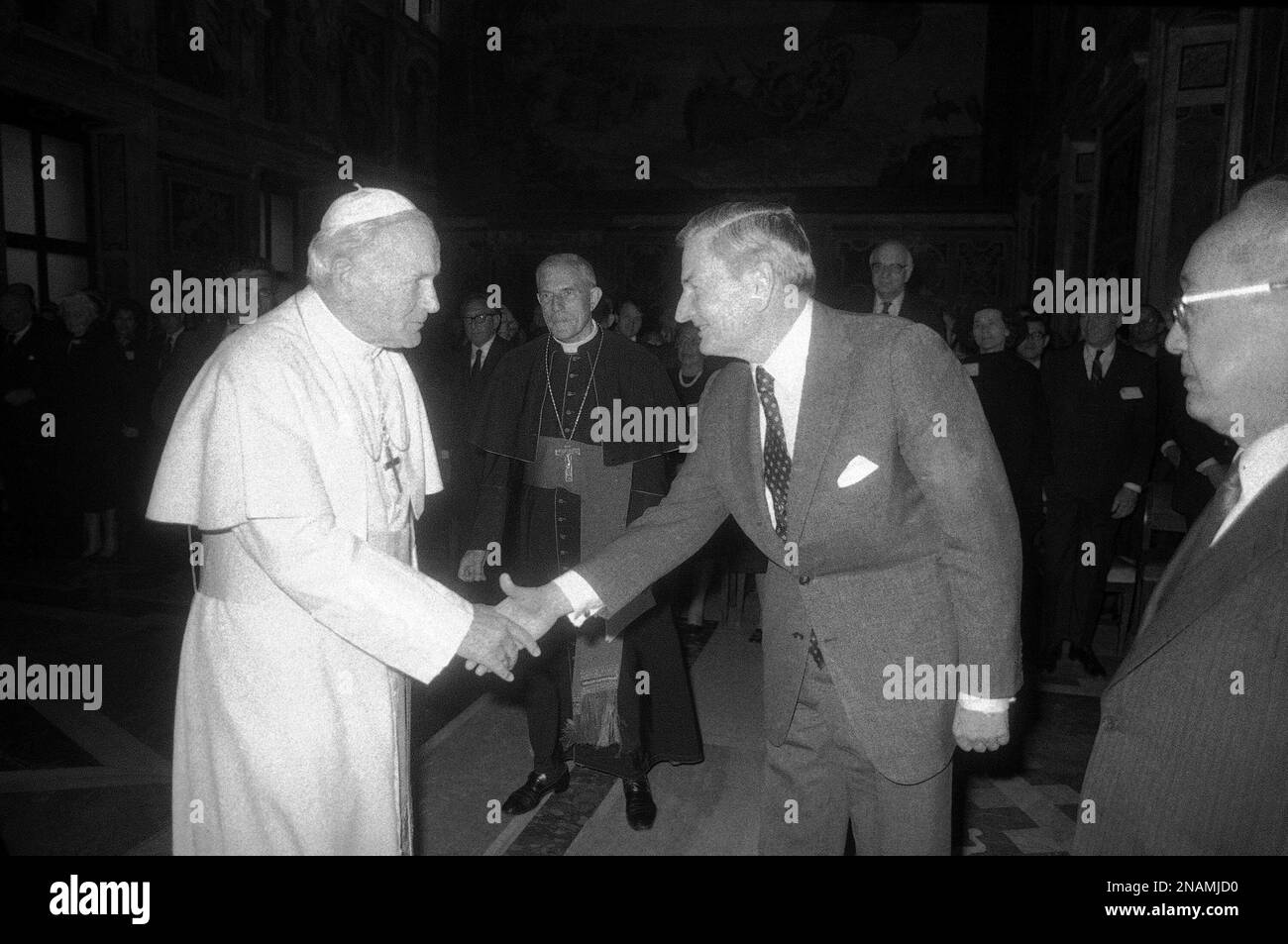 Pope Paul II shakes hands with David Rockefeller, former chairman of ...