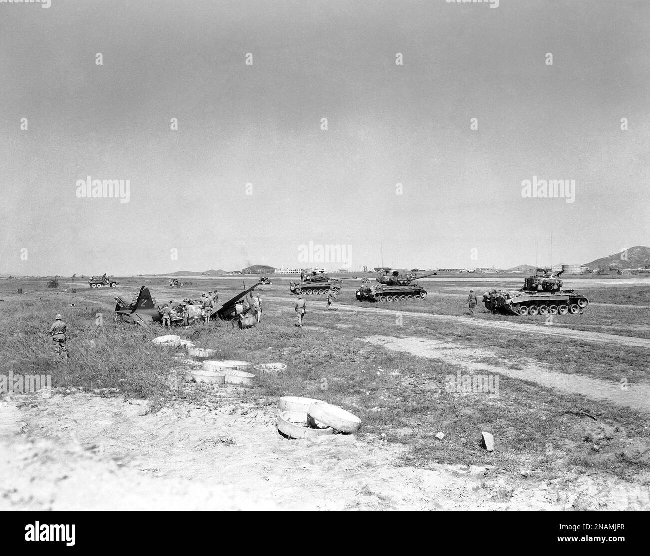 General view of Kimpo airfield with tanks guarding the runway in South ...