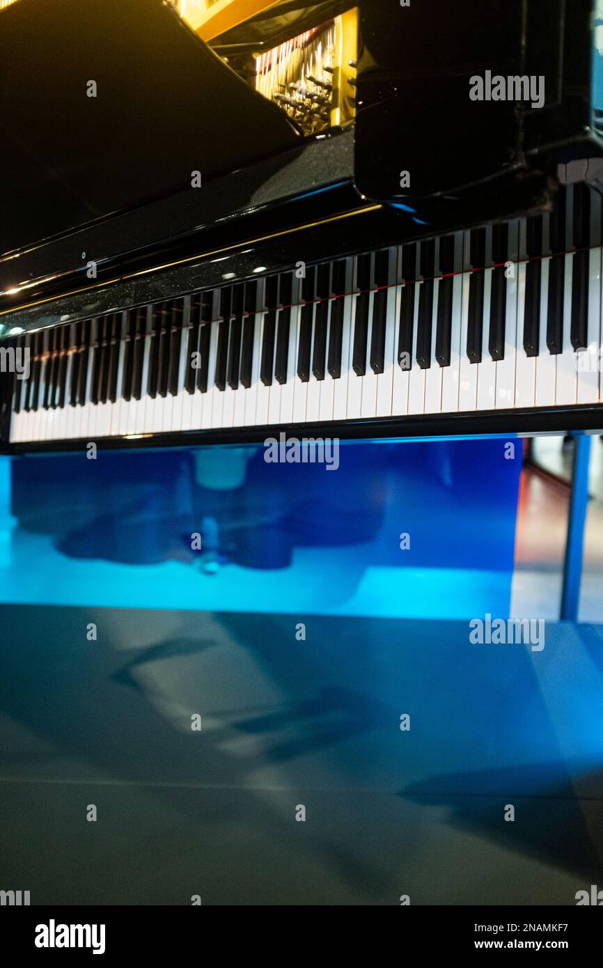 Long tail black piano keyboard on an abstract blue background Stock ...