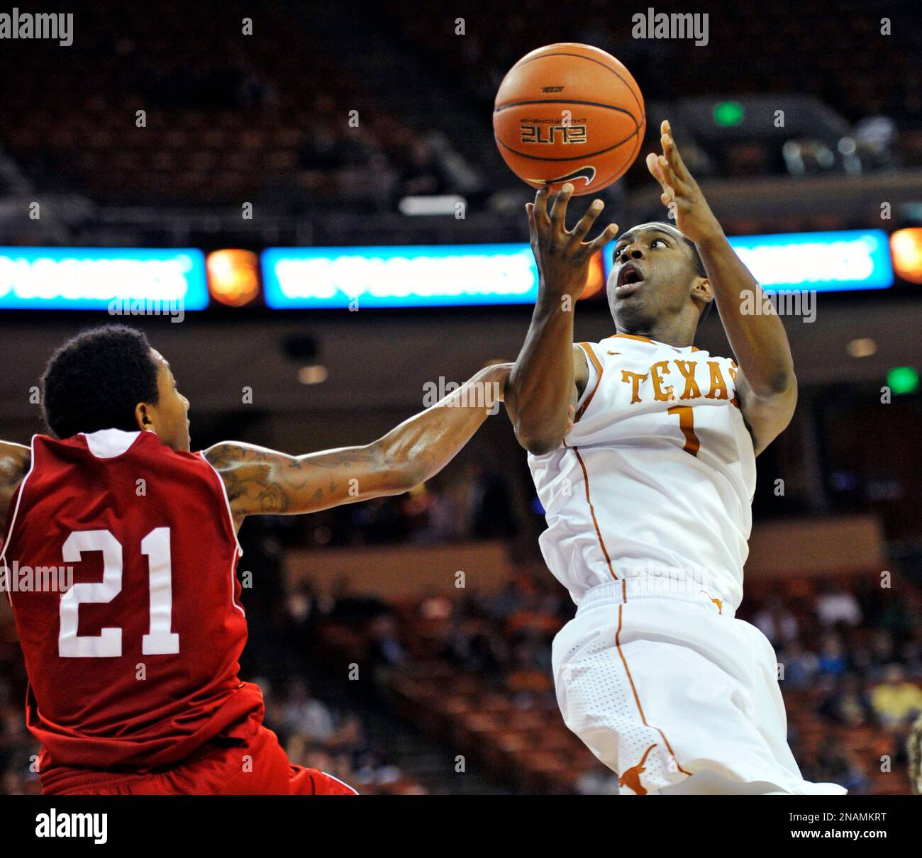 Texas guard Sheldon McClellan, right, goes up against Nicholls State ...