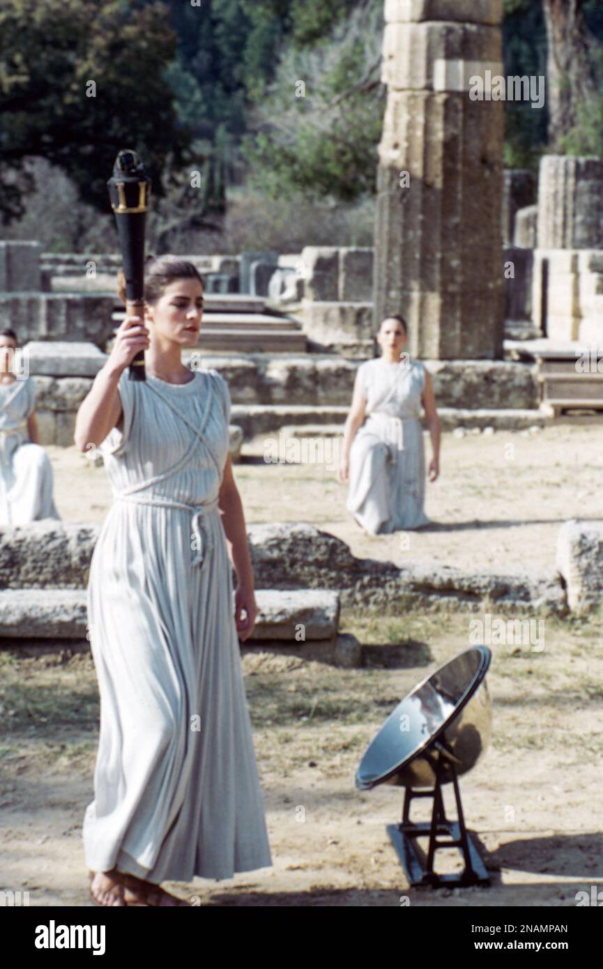 The Olympic torch is carried by Maria Pambouki, 26, a Greek actress who ...
