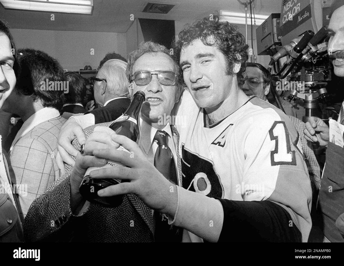 Philadelphia Flyers coach Fred Shero, left, and defenseman Joe Watson ...