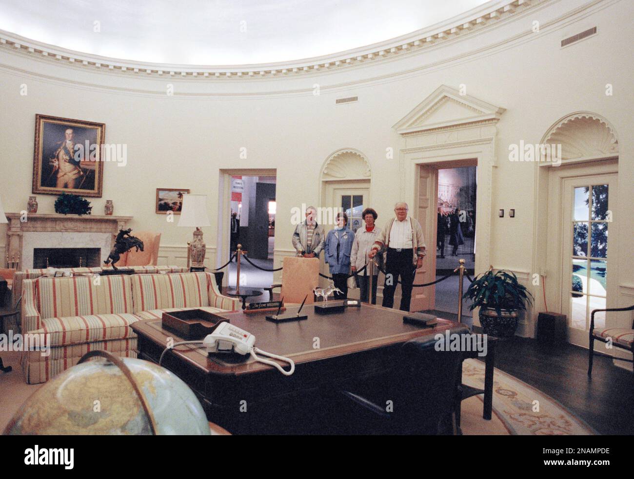 Visitors look at President Jimmy Carter’s Oval Office on display at the ...