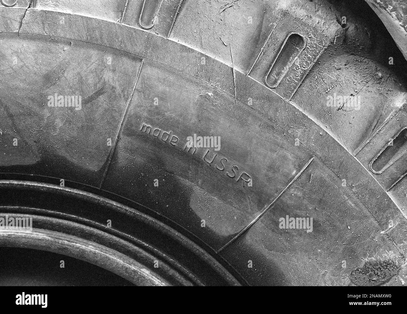 Close-up of the tire on a truck which reads "Made in USSR" during ...