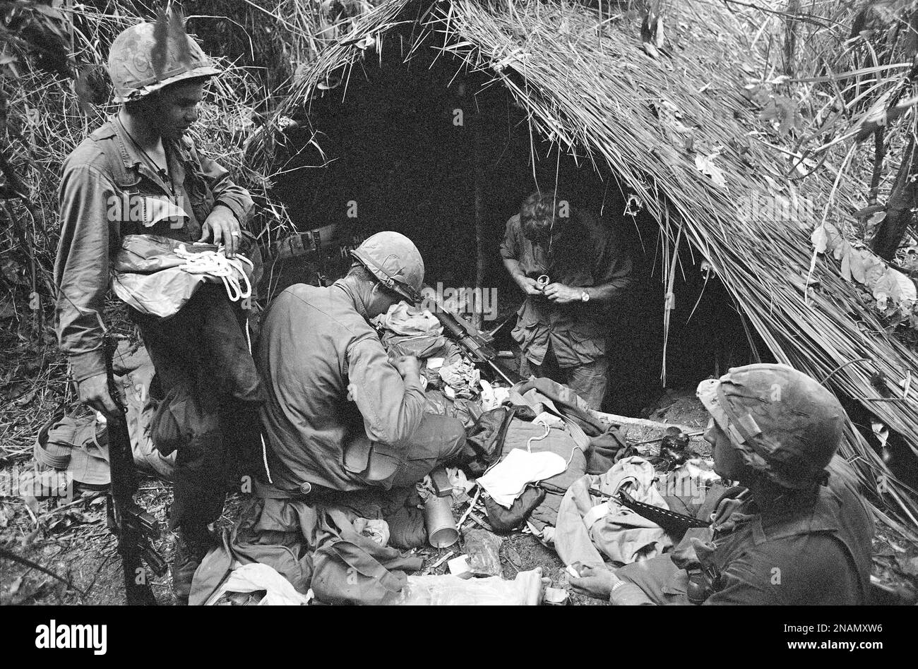 U.S. soldiers maintain their equipment during Operation Delaware in the ...