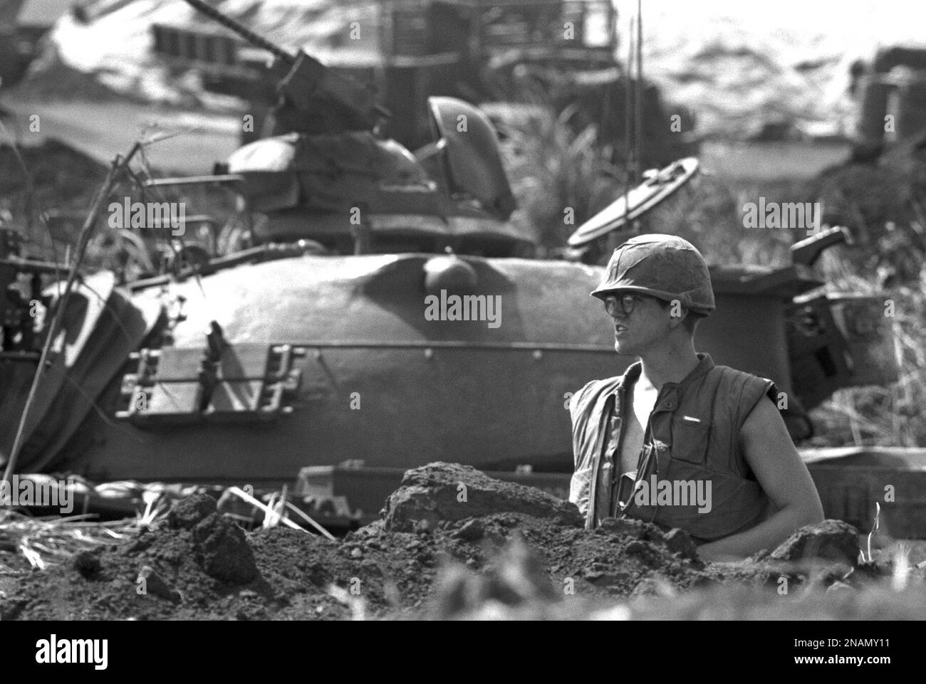 A U.S. Marine looks out from base perimeter at Khe Sanh toward North ...