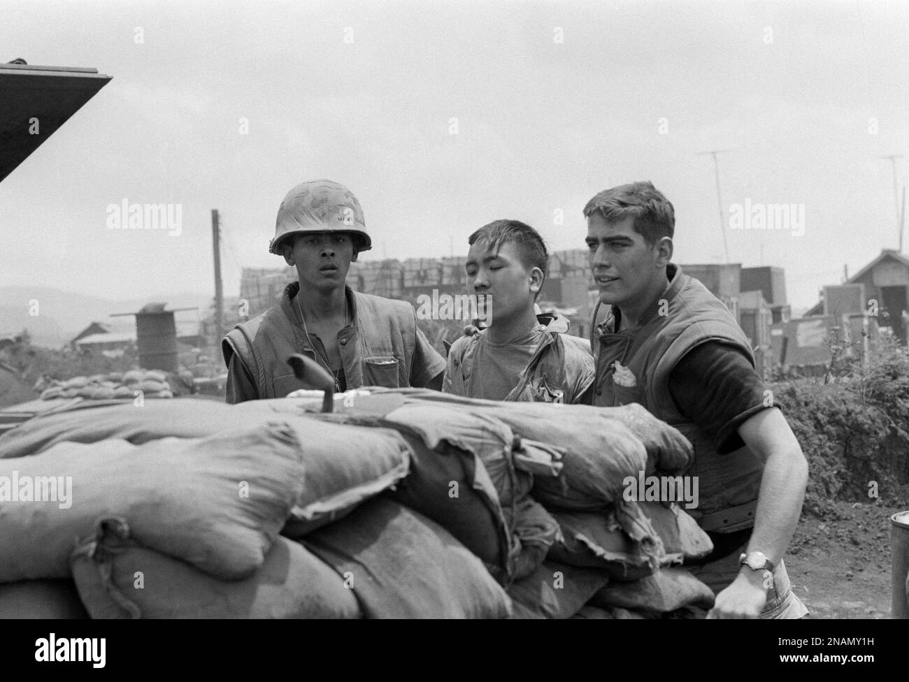 U.S. Marines lead a North Vietnamese regular captured on the camp’s ...