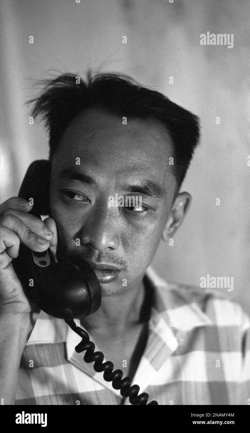 Brig. Gen. Nguyen Ngoc Loan talks on a field phone in his command post ...