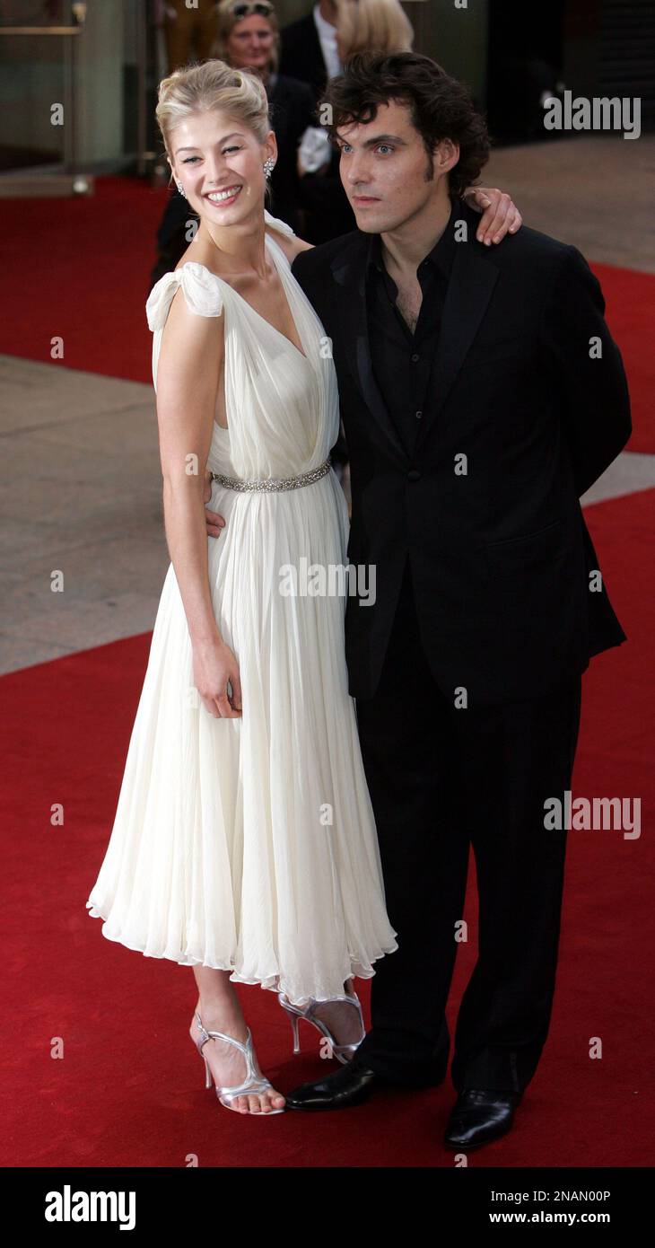 Actress Rosamund Pike and an unidentified partner arrive at the ...