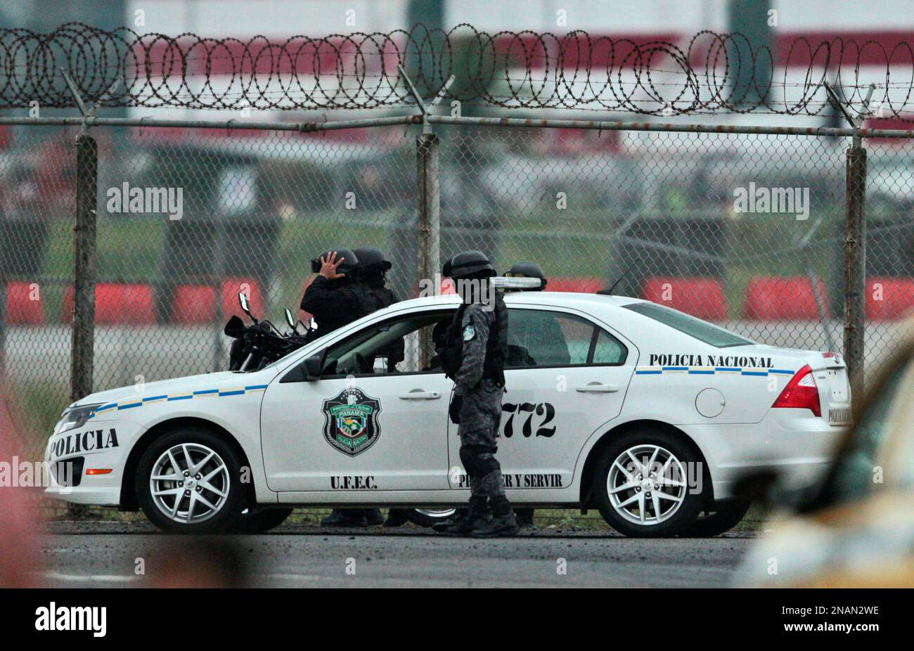 Panama's police officers stand guard outside Tocumen international ...