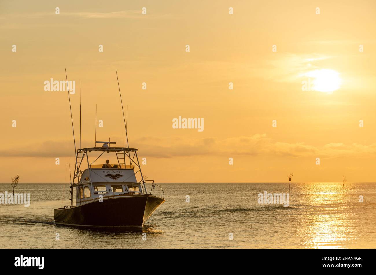 Charter Fishing Boat. Sunset. Rock Harbor Marker Trees. Rock Harbor ...