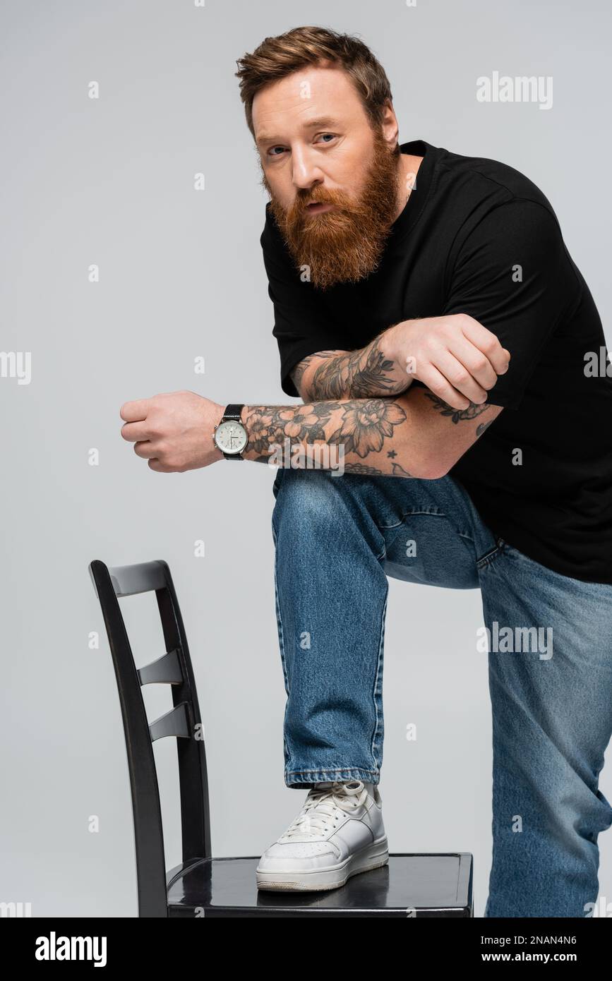 Man stepping on chair hi-res stock photography and images - Alamy