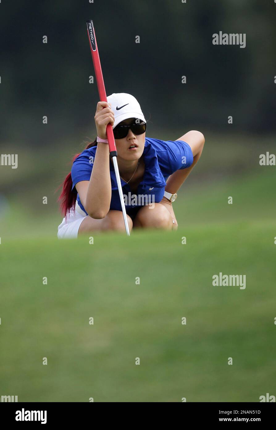 Michelle Wie lines up a putt on the second green during the third round ...