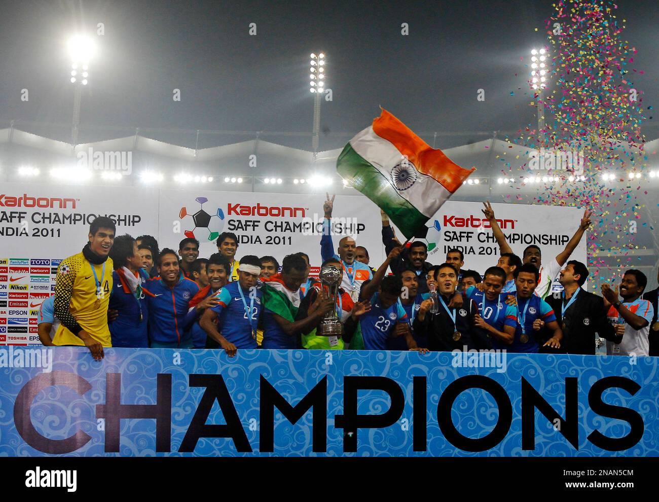 Indian team members pose with the trophy after winning the final match ...