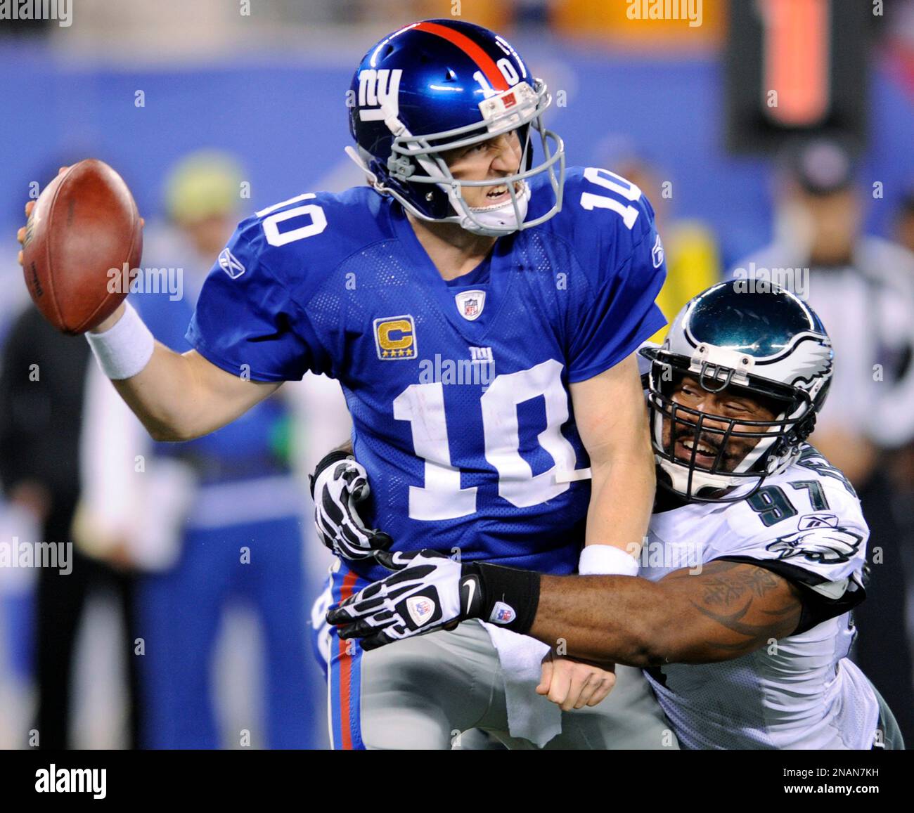 New York Giants quarterback Eli Manning (10) is sacked by Philadelphia Eagles defensive tackle ...