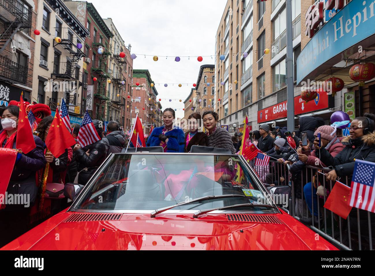 Chinese women riding in a red car at the 25th Annual Chinese Lunar New ...