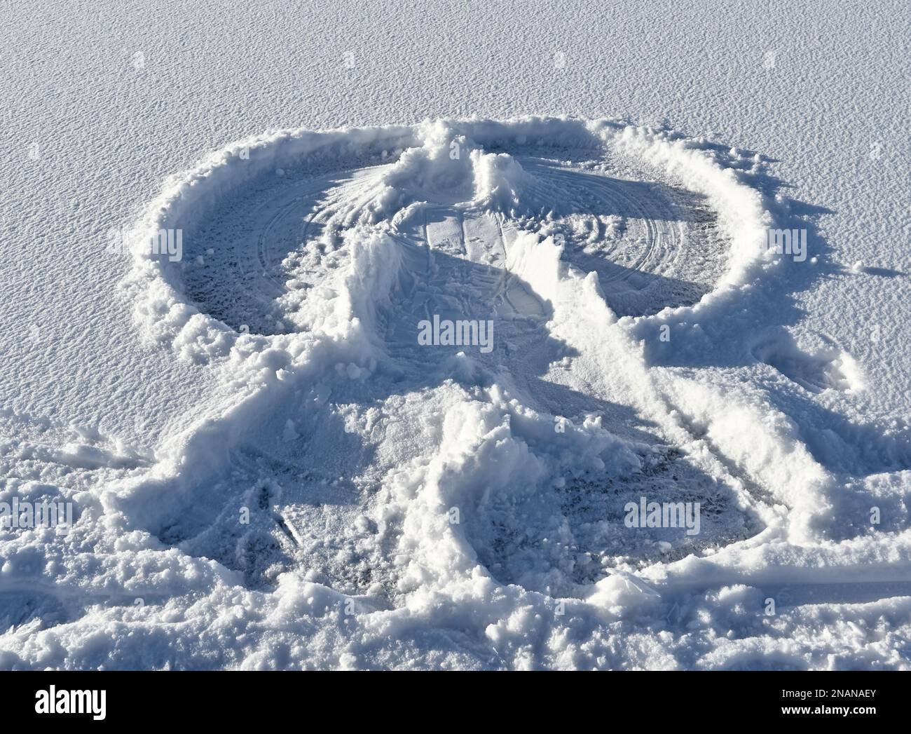 snow angel on the snowy surface of the lake Stock Photo - Alamy