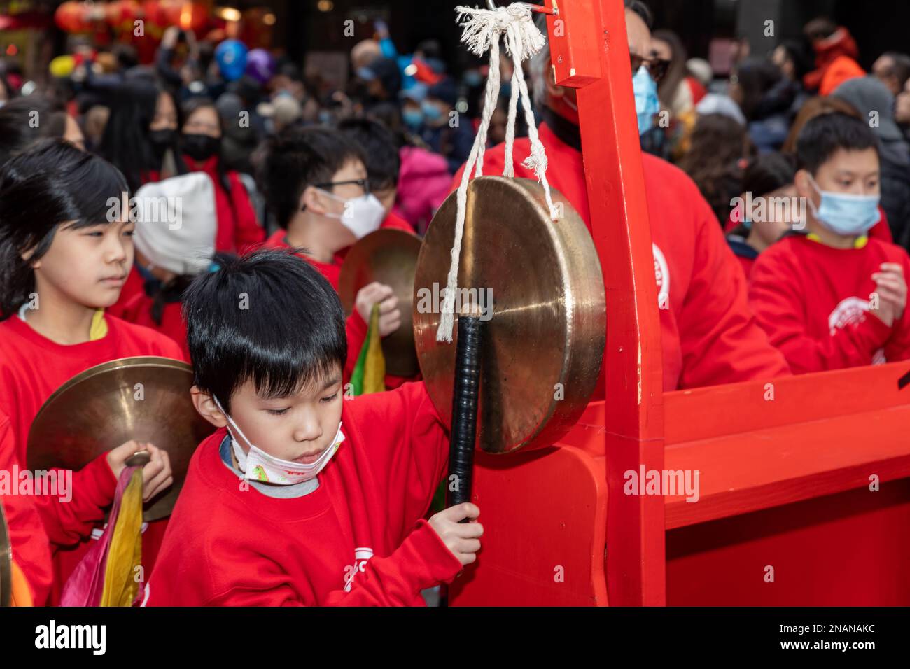 A young child holding a gong during the 25th Annual Chinese Lunar New ...