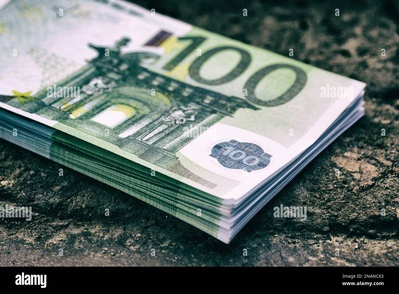 a stack of money one hundred euros lies on the stone steps Stock Photo ...