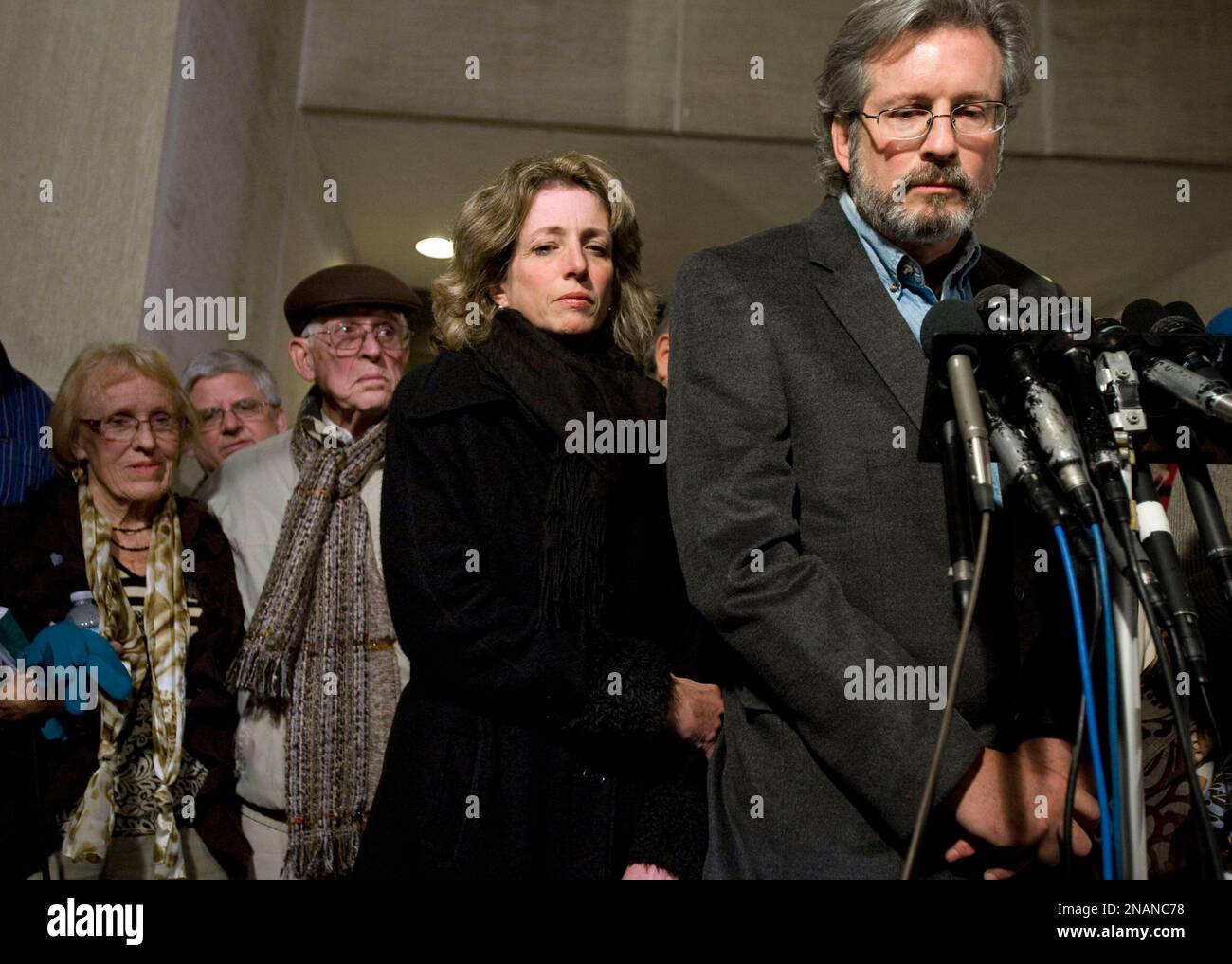 Dr. William Petit Jr., right, speaks to the media as mother and father ...