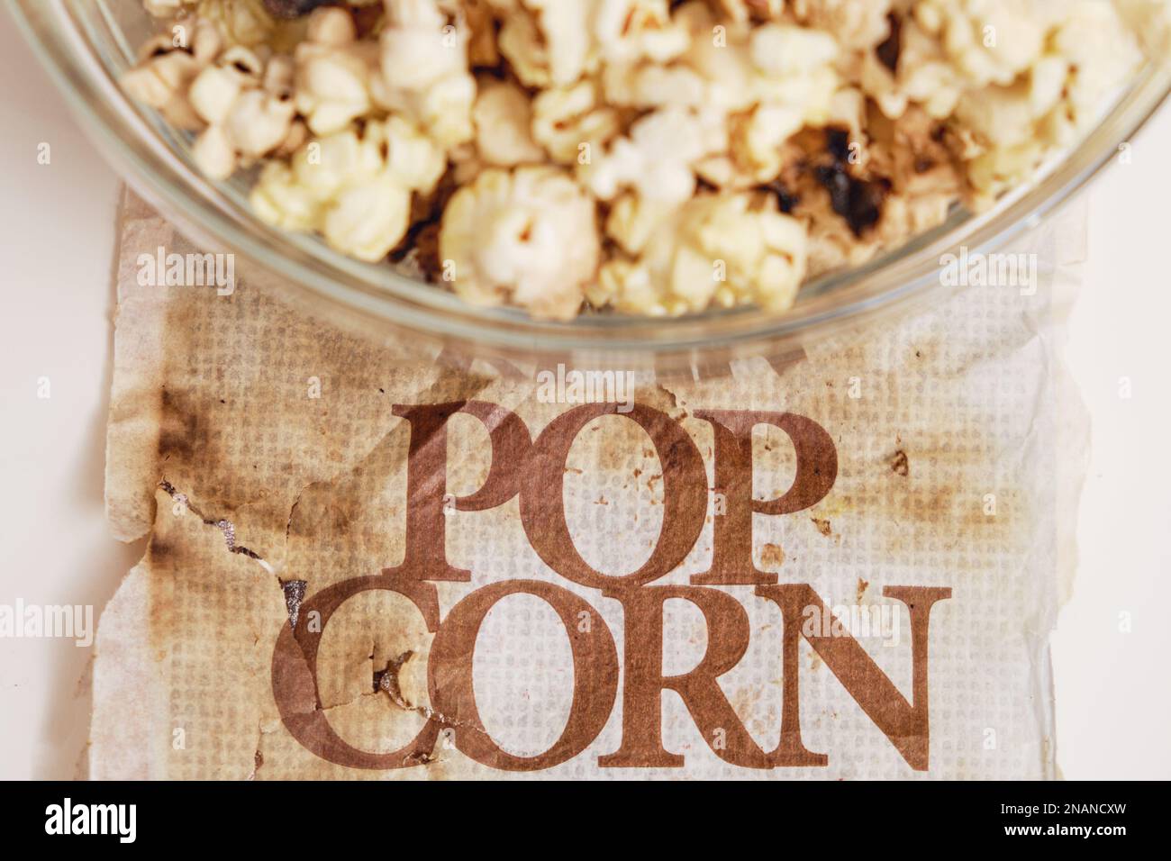 Burnt popcorn from a home microwave. Burn corn kernels on the kitchen ...