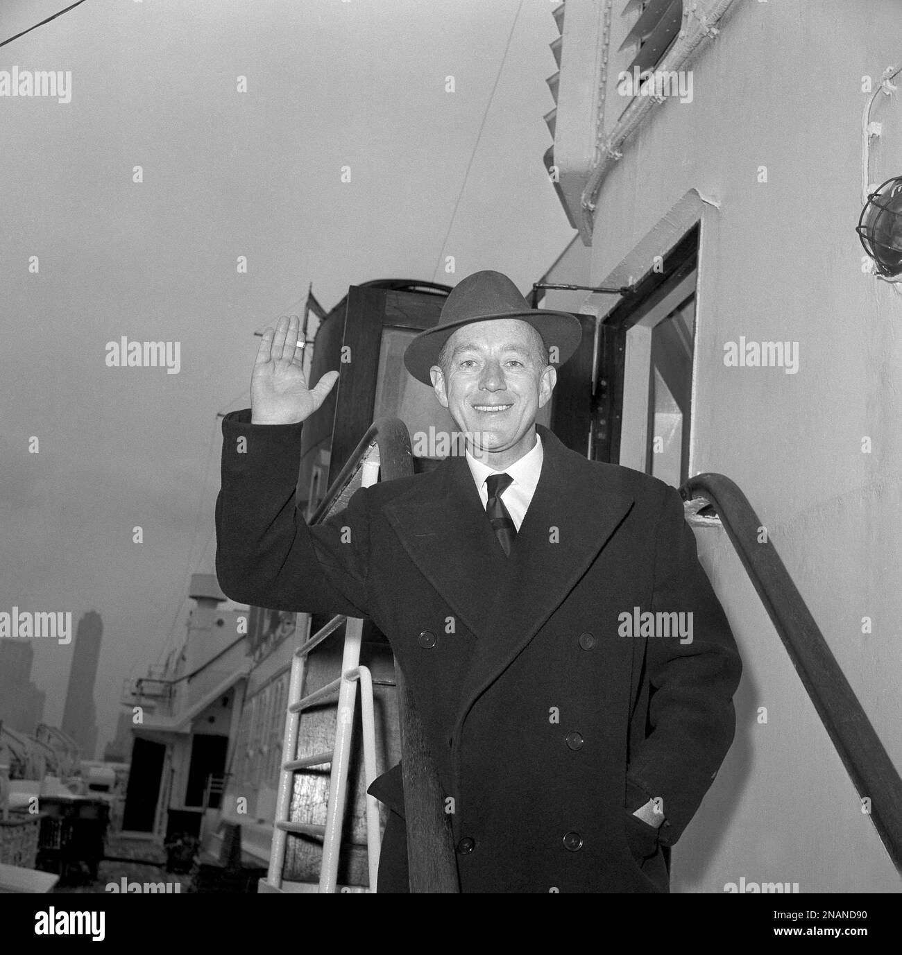 Sir Alec Guinness, famed English actor, waves aboard the liner Liberte ...