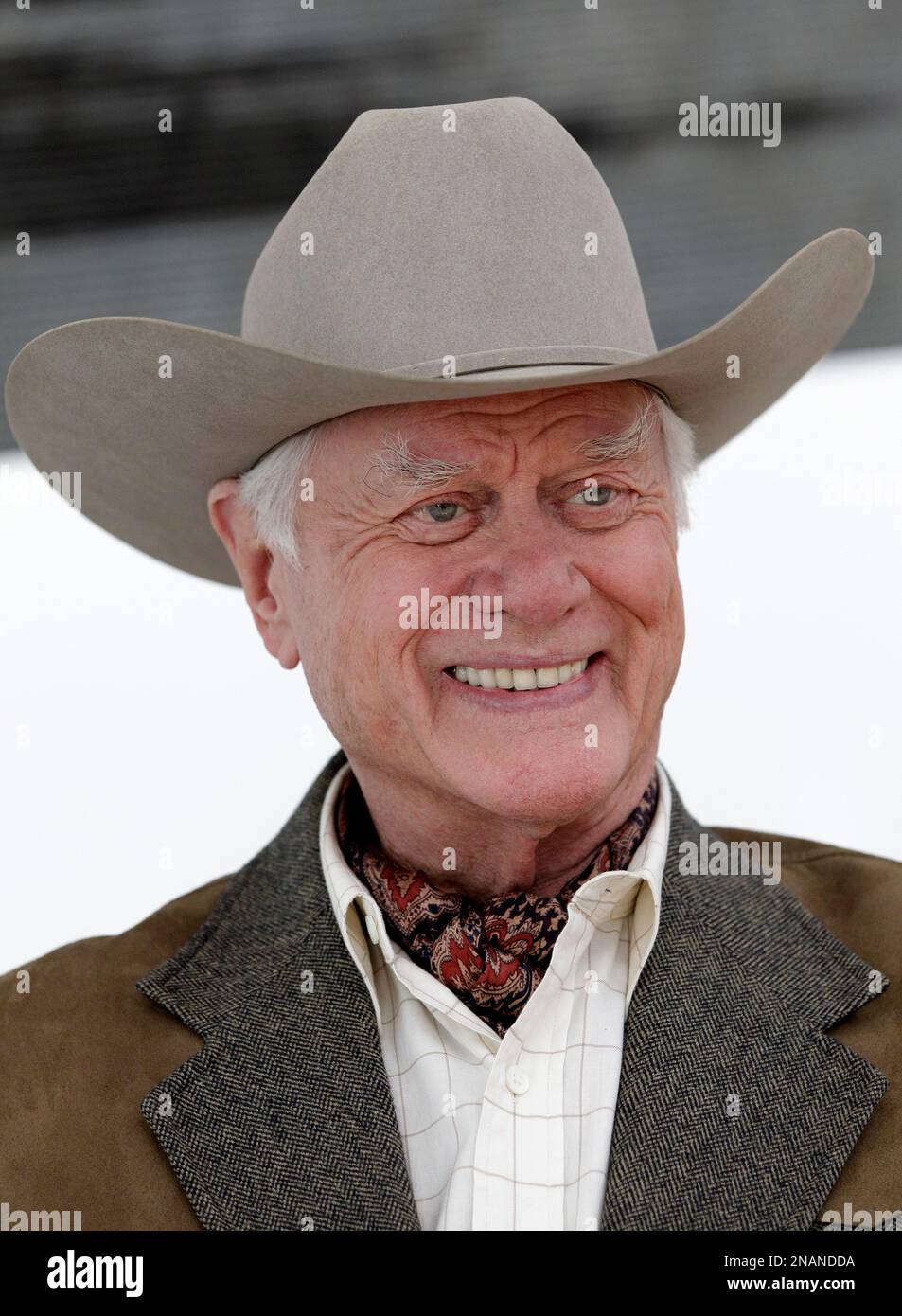 Actor Larry Hagman smiles as he gives an interview while on location ...