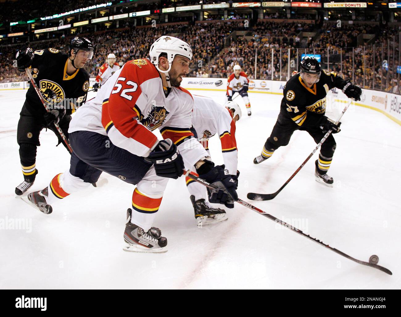 Florida Panthers defenseman Jason Garrison (52) clears the puck away ...