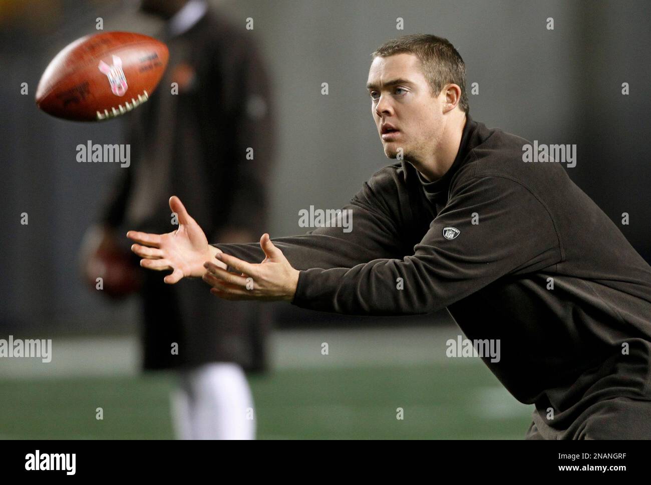 Cleveland Browns quarterback Colt McCoy catches while he warms up ...