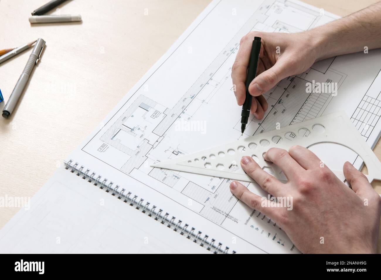 Architecture scheme with hands drawing Stock Photo - Alamy