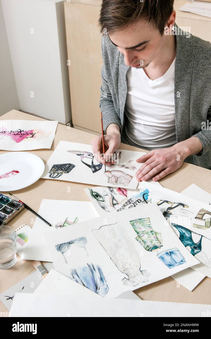 Designer of fashion indusrty works on sketches Stock Photo - Alamy