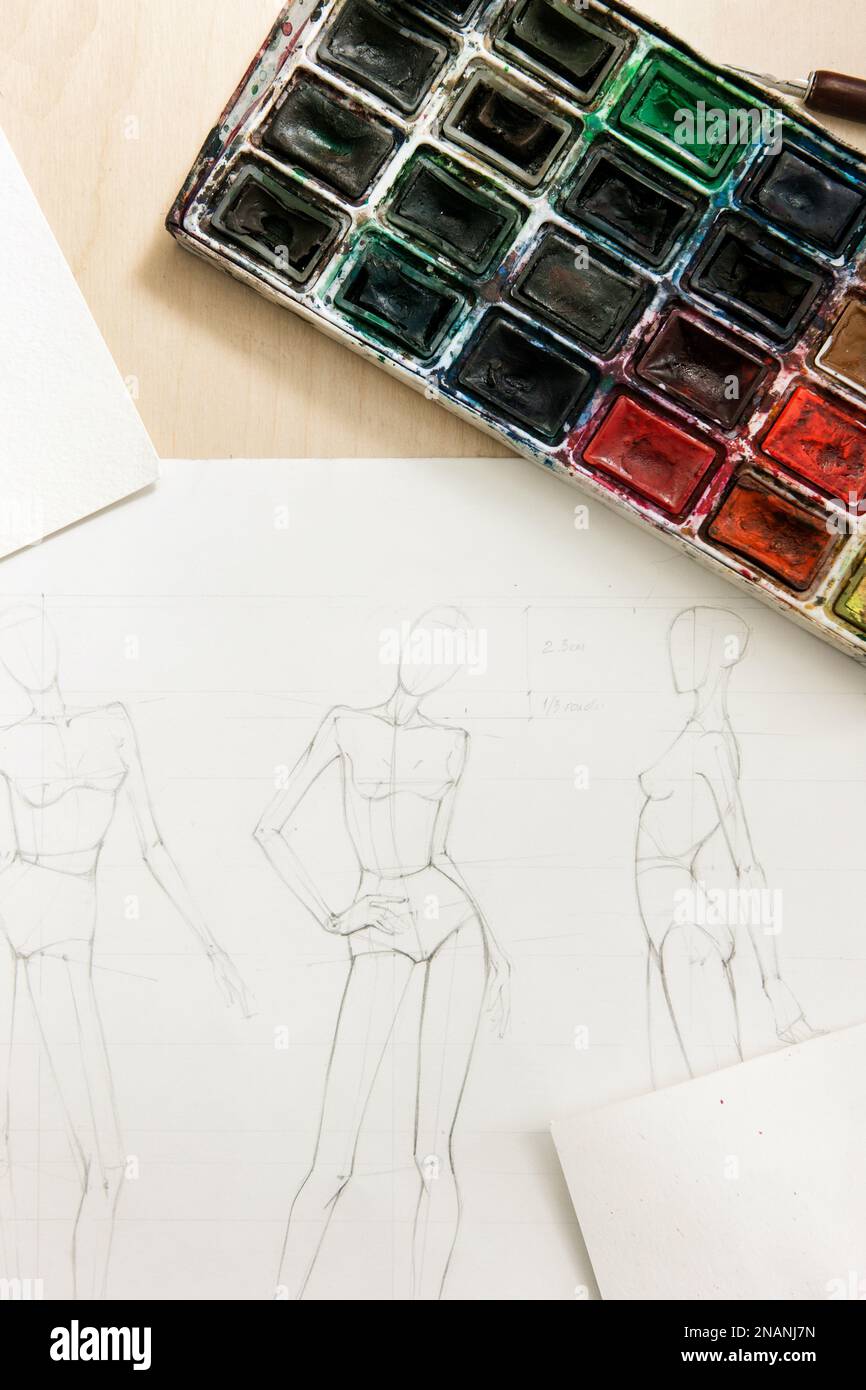 Sketches of fashion models on desk Stock Photo - Alamy