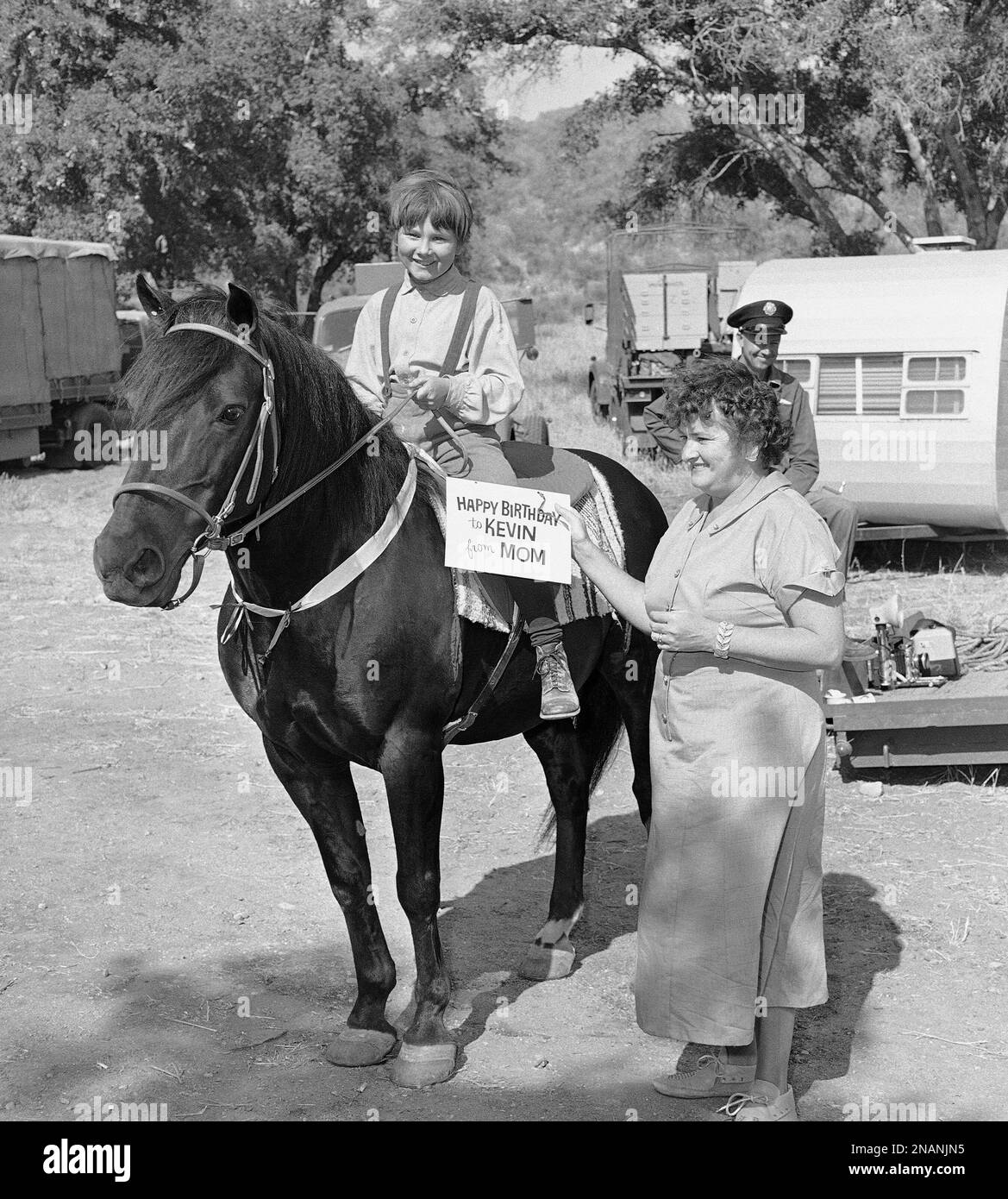 Ten-year-old Kevin Corcoran, an actor for Walt Disney Productions, sits ...