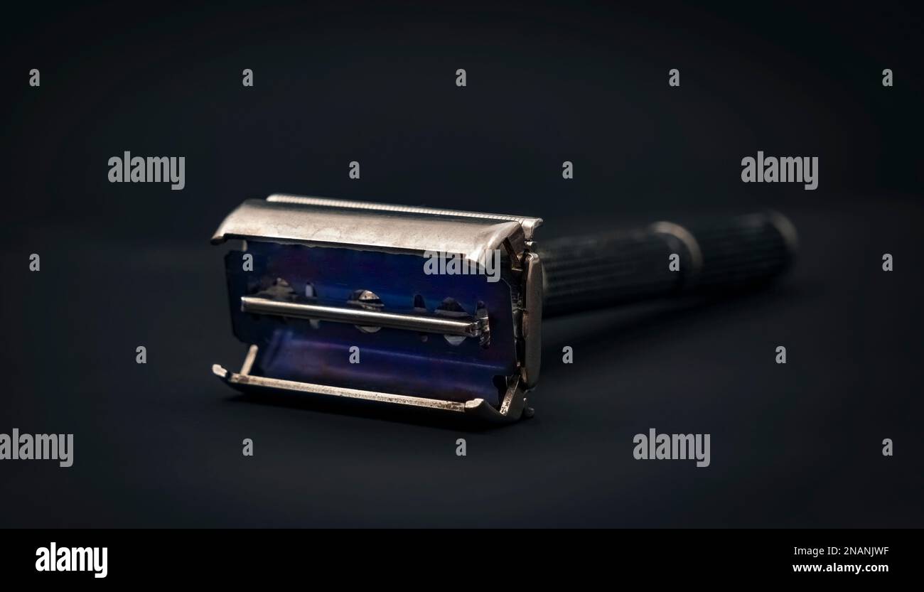 old school vintage razor and razor blade on black background Stock ...