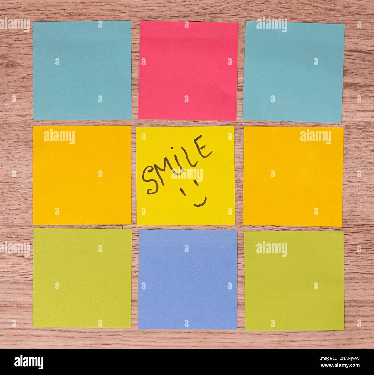 post it with smile on wooden parquet Stock Photo - Alamy