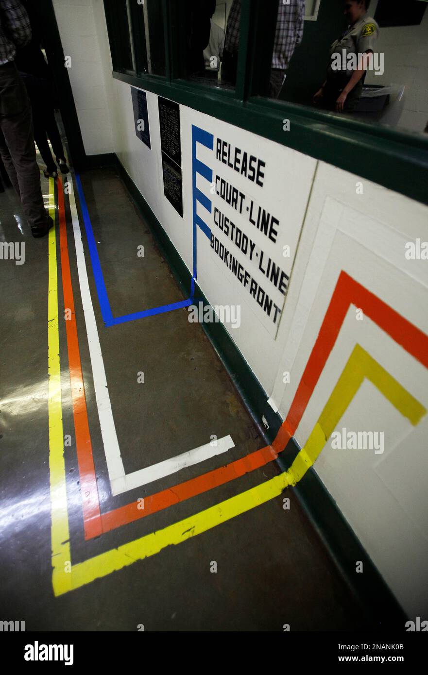 Lines on the floor direct inmates, seen during a tour of the Men's ...