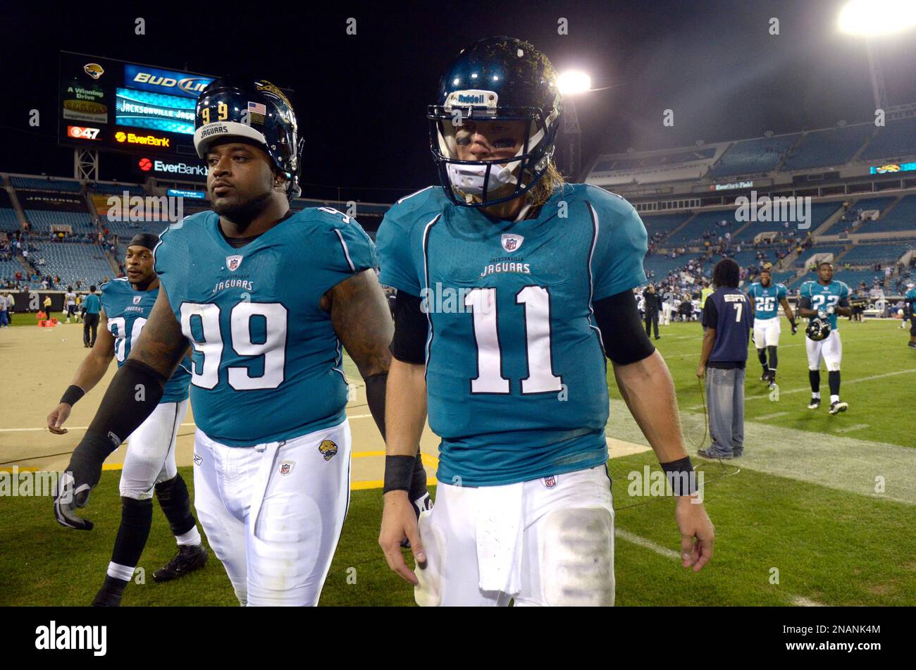 Jacksonville Jaguars defensive tackle C.J. Mosley (99) and quarterback ...