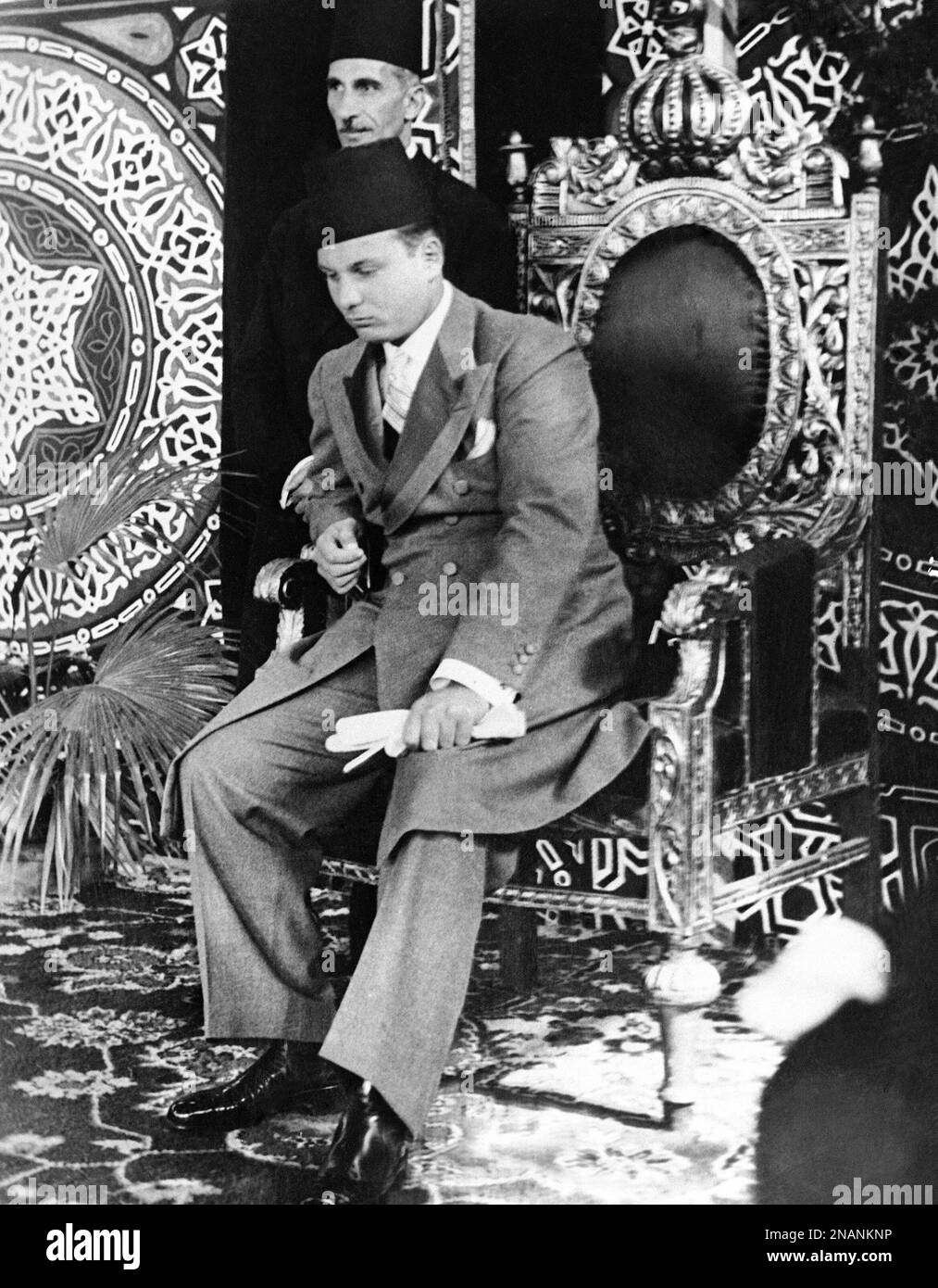 King Farouk seated on the throne, in Cairo, Egypt, on July 28, 1937 ...