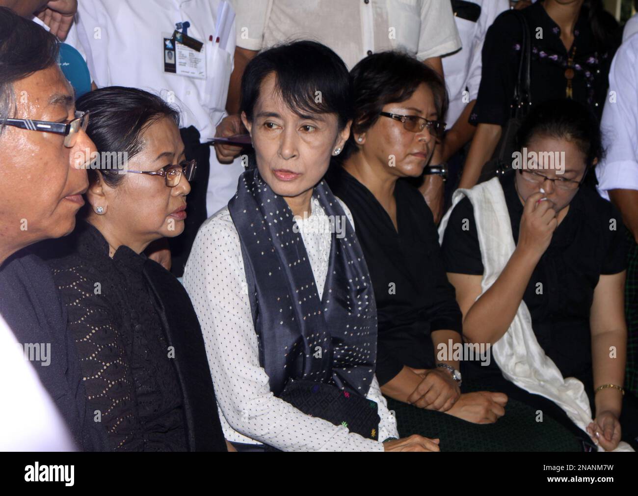 Myanmar's pro-democracy leader Aung San Suu Kyi, center, talks with ...