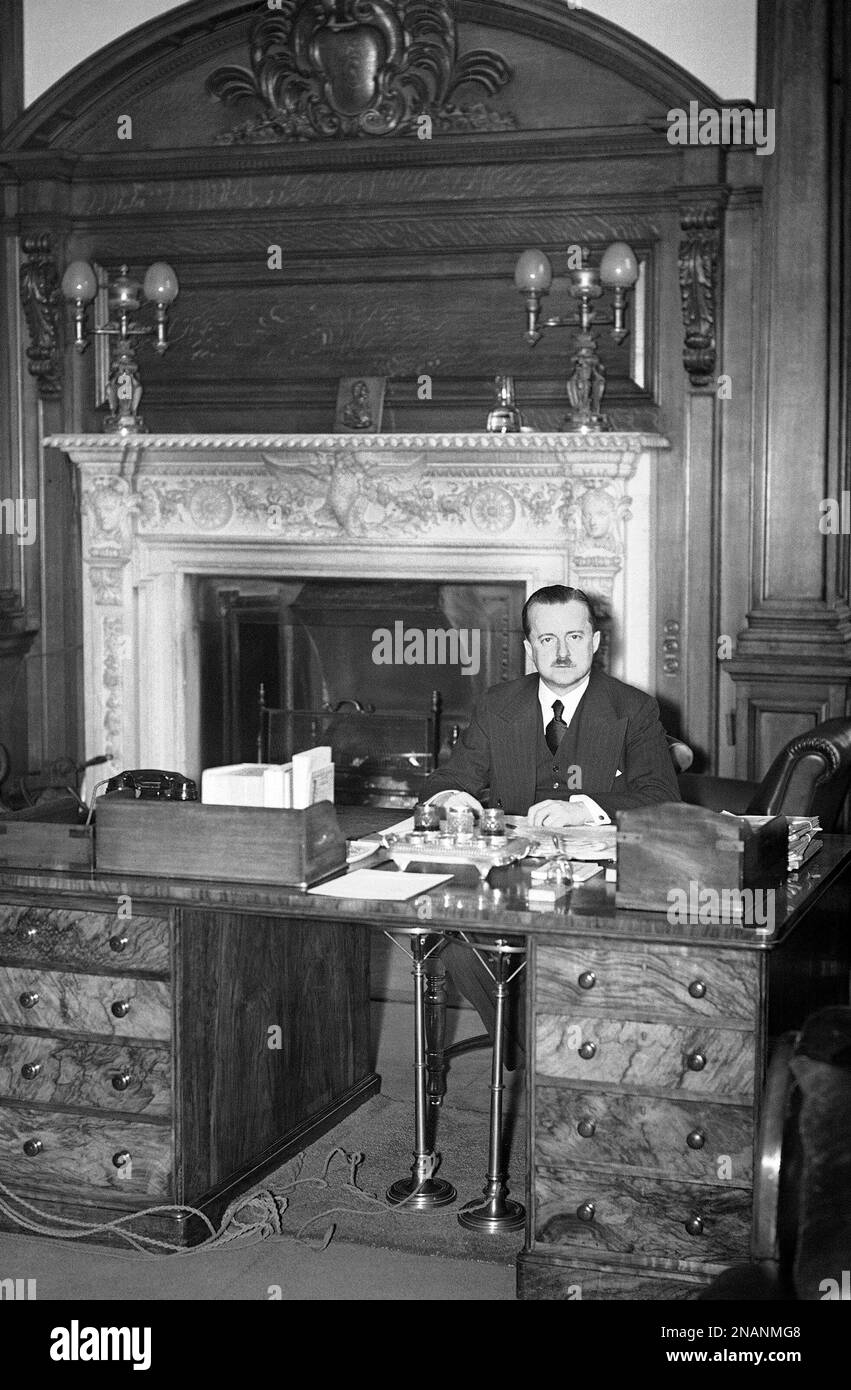 Britain's Minister for War Alfred Duff Cooper,at his desk in the War ...
