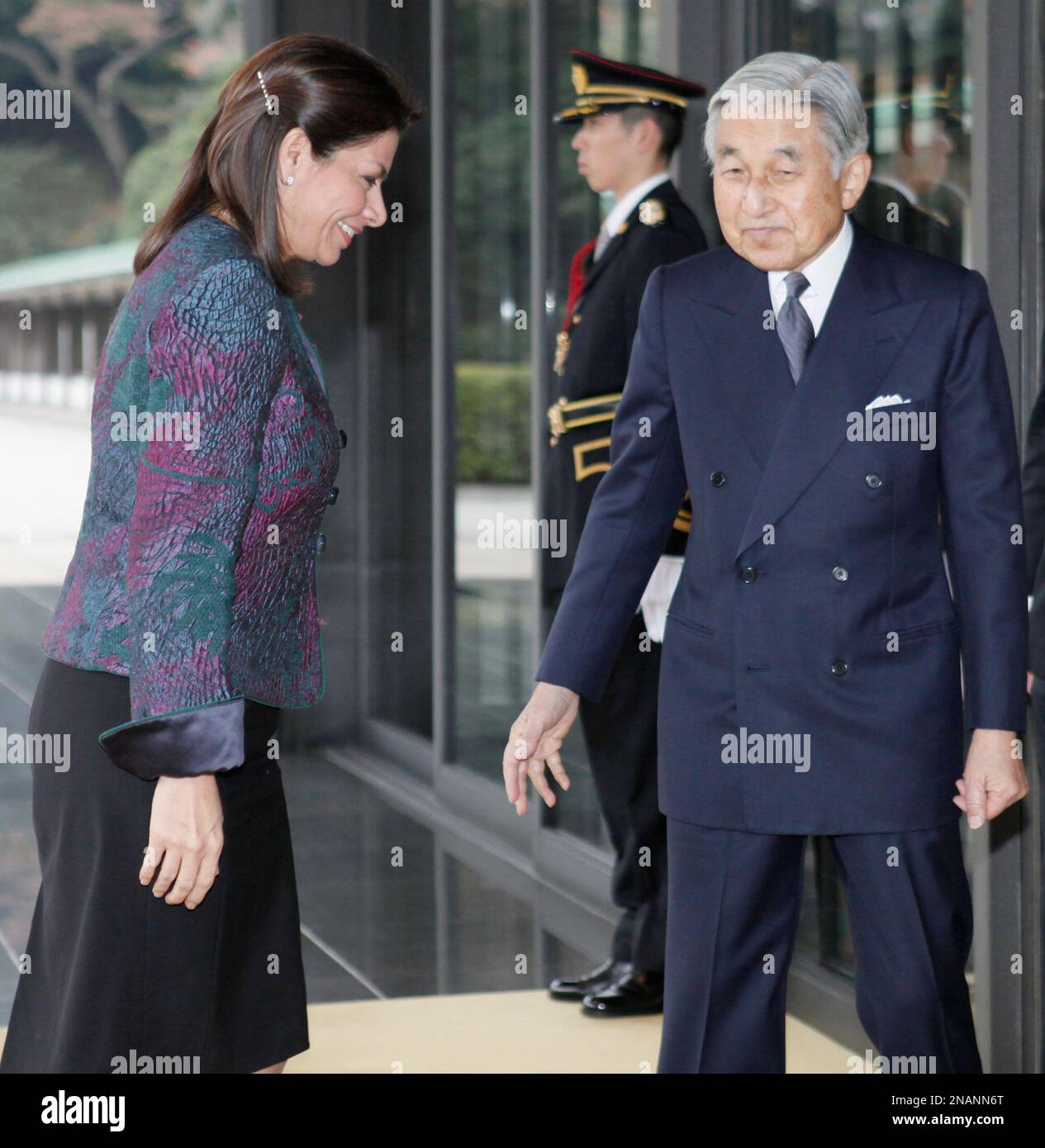 Costa Rican President Laura Chinchilla Miranda, left, is greeted by ...