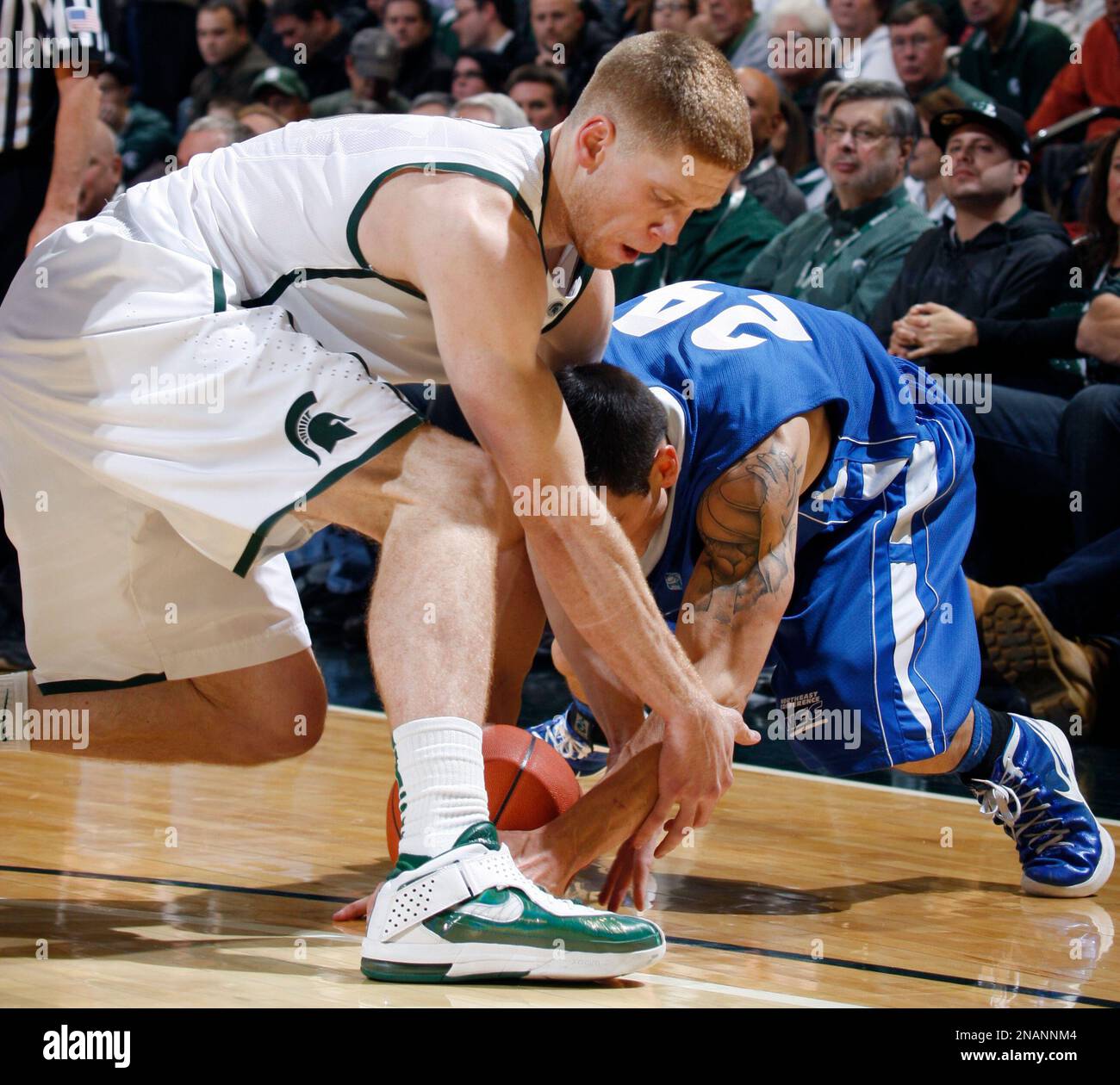 Michigan State's Russell Byrd, left, and Central Connecticut State's ...