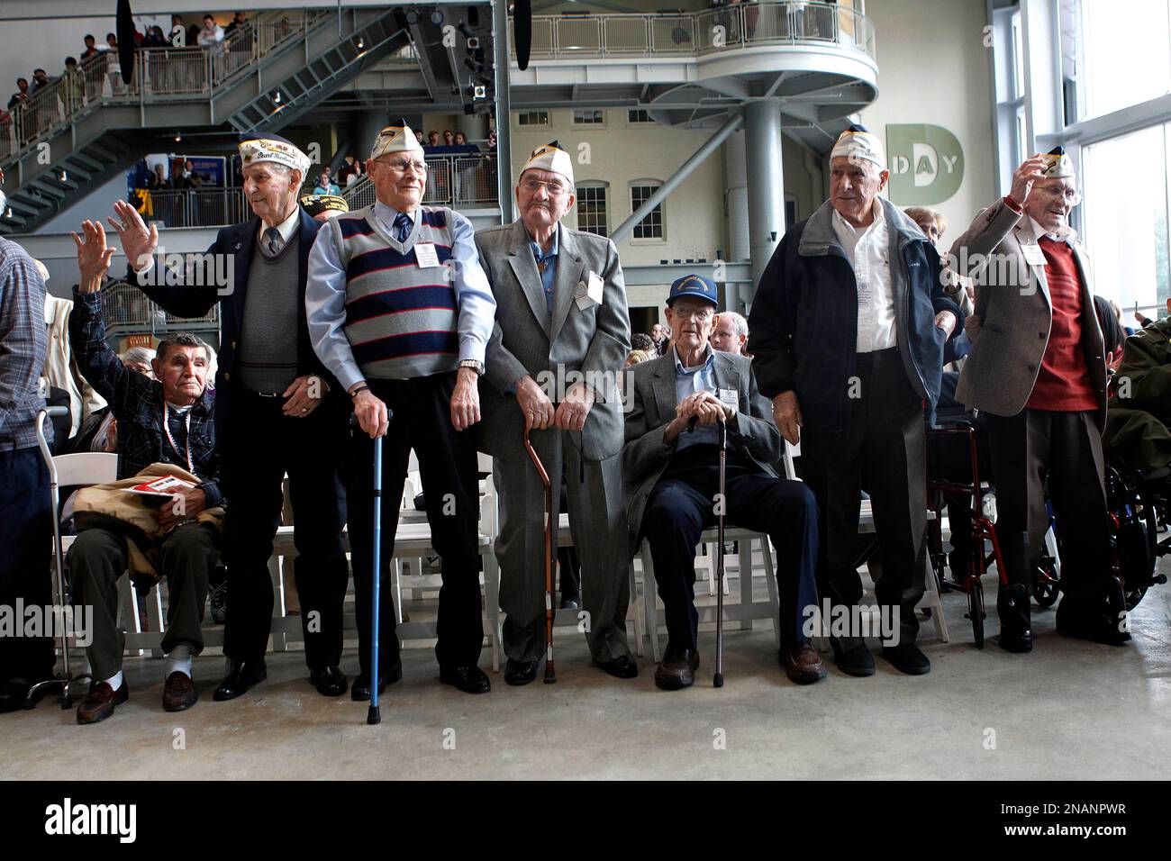 Pearl Harbor survivors acknowledge the crowd at a ceremony to observe ...