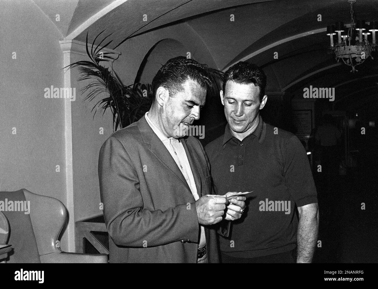 Otto Graham, new coach of the Washington Redskins, confers with Edward ...