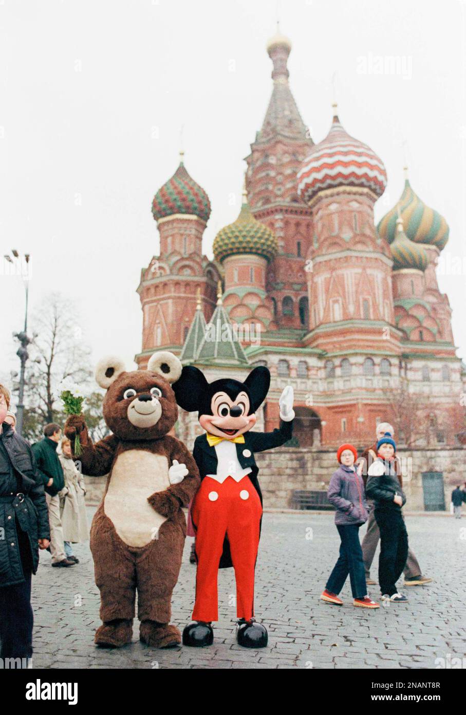 Passing Soviets crane to look at Mickey Mouse and Misha the Bear, the ...