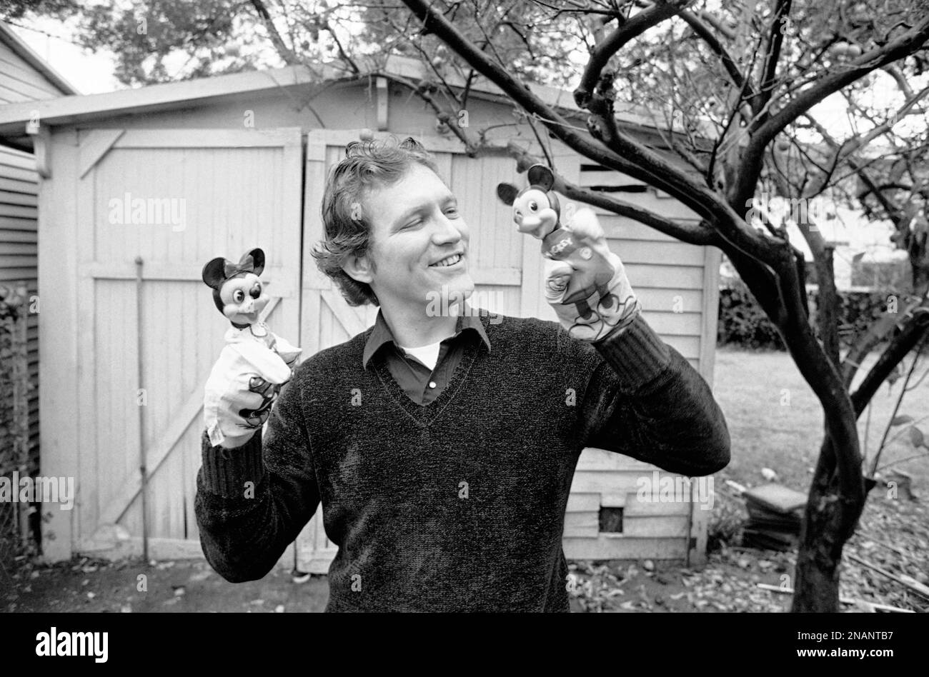 Paul Maher shows off Mickey and Minnie Mouse puppets in front of Walt ...