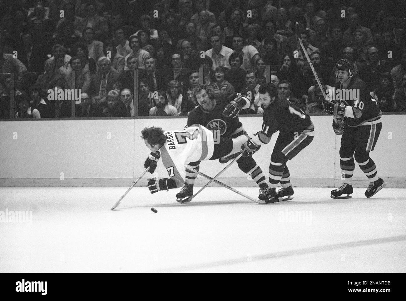 Gerry Hart, left, and Billy MacMillan (11) of New York Islanders team ...